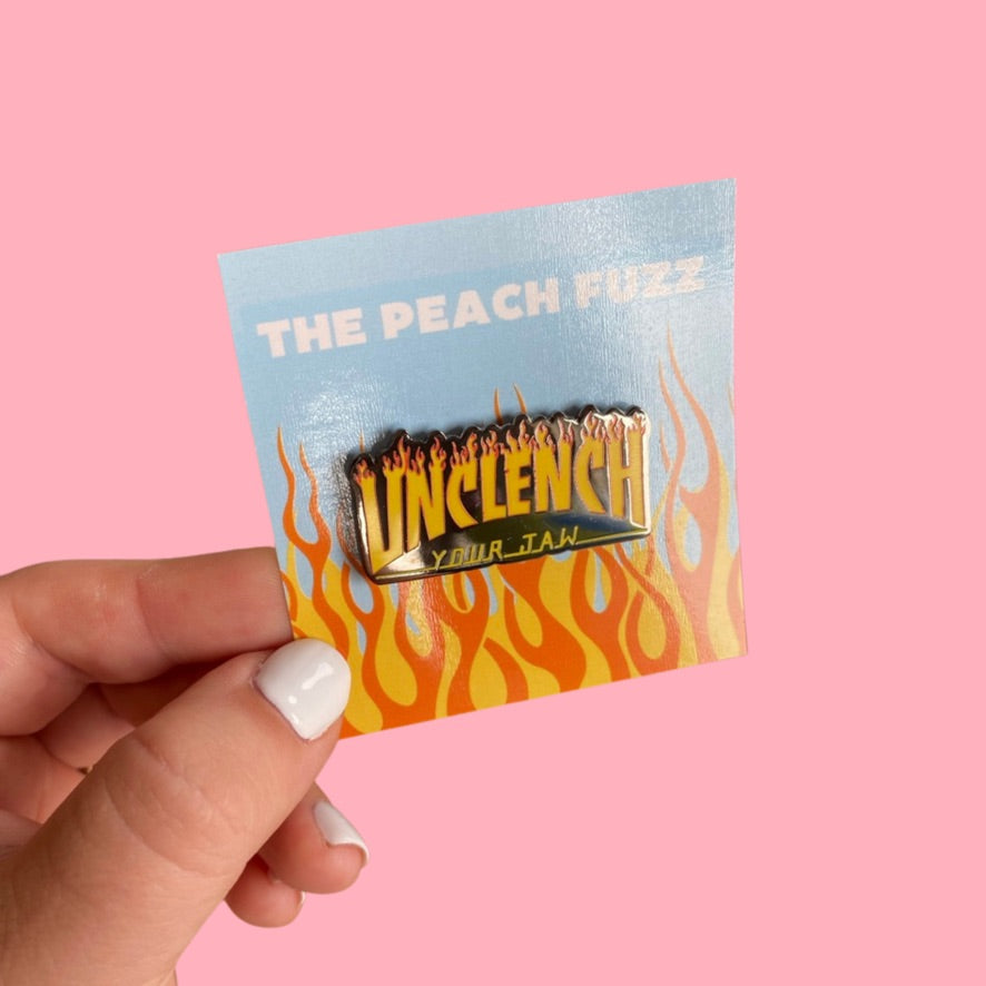 Unclench Your Jaw Enamel Pin – The Peach Fuzz